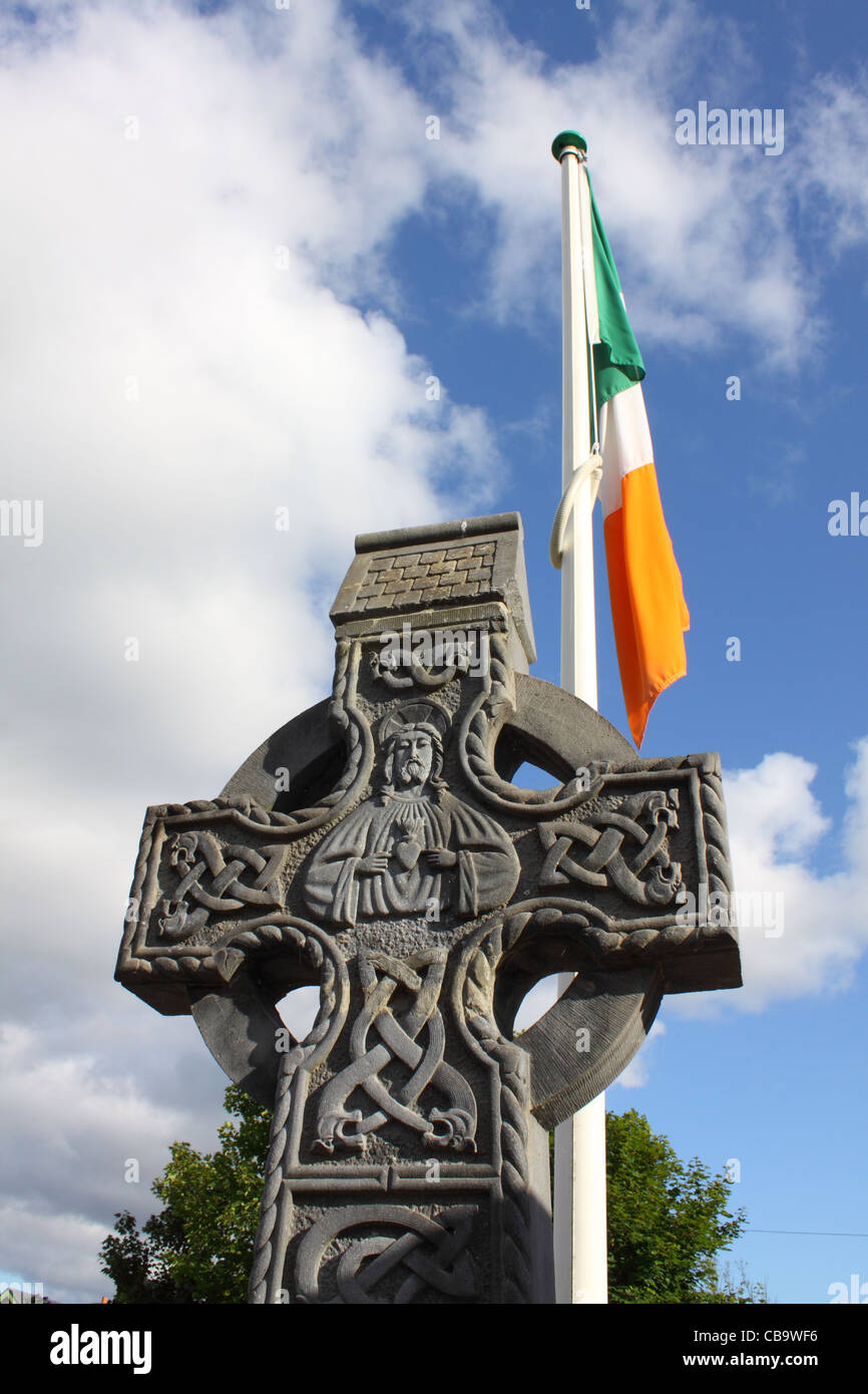 Celtic cross and Irish flag near Kenmare, County Kerry, Ireland Stock ...