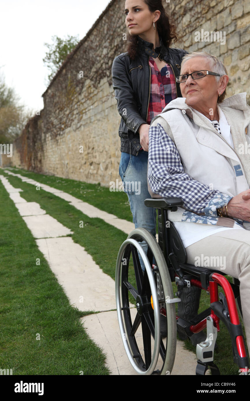 Pushing grandma in wheelchair hi-res stock photography and images - Alamy