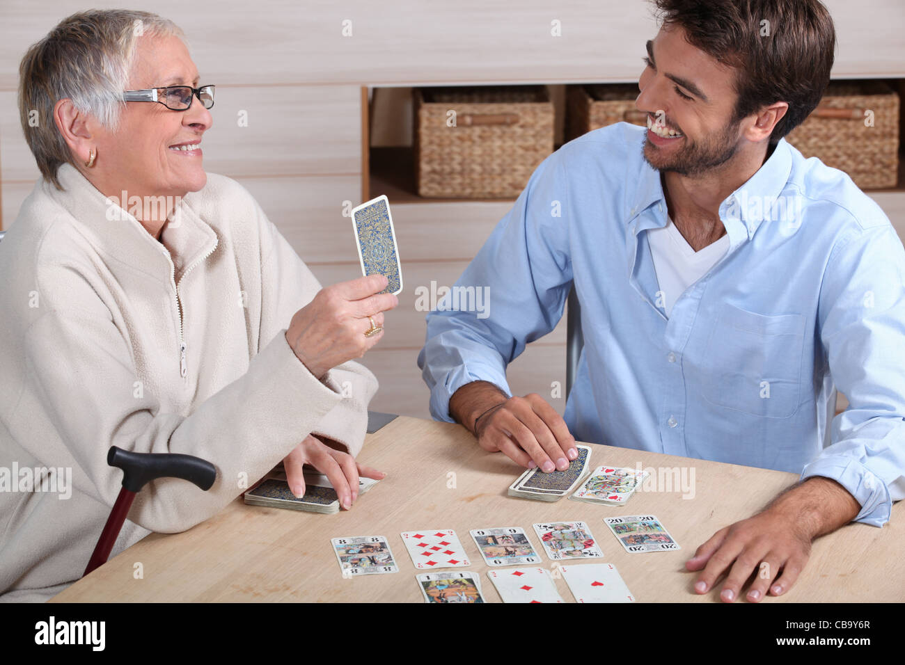 Mother and son playing cards Stock Photo - Alamy