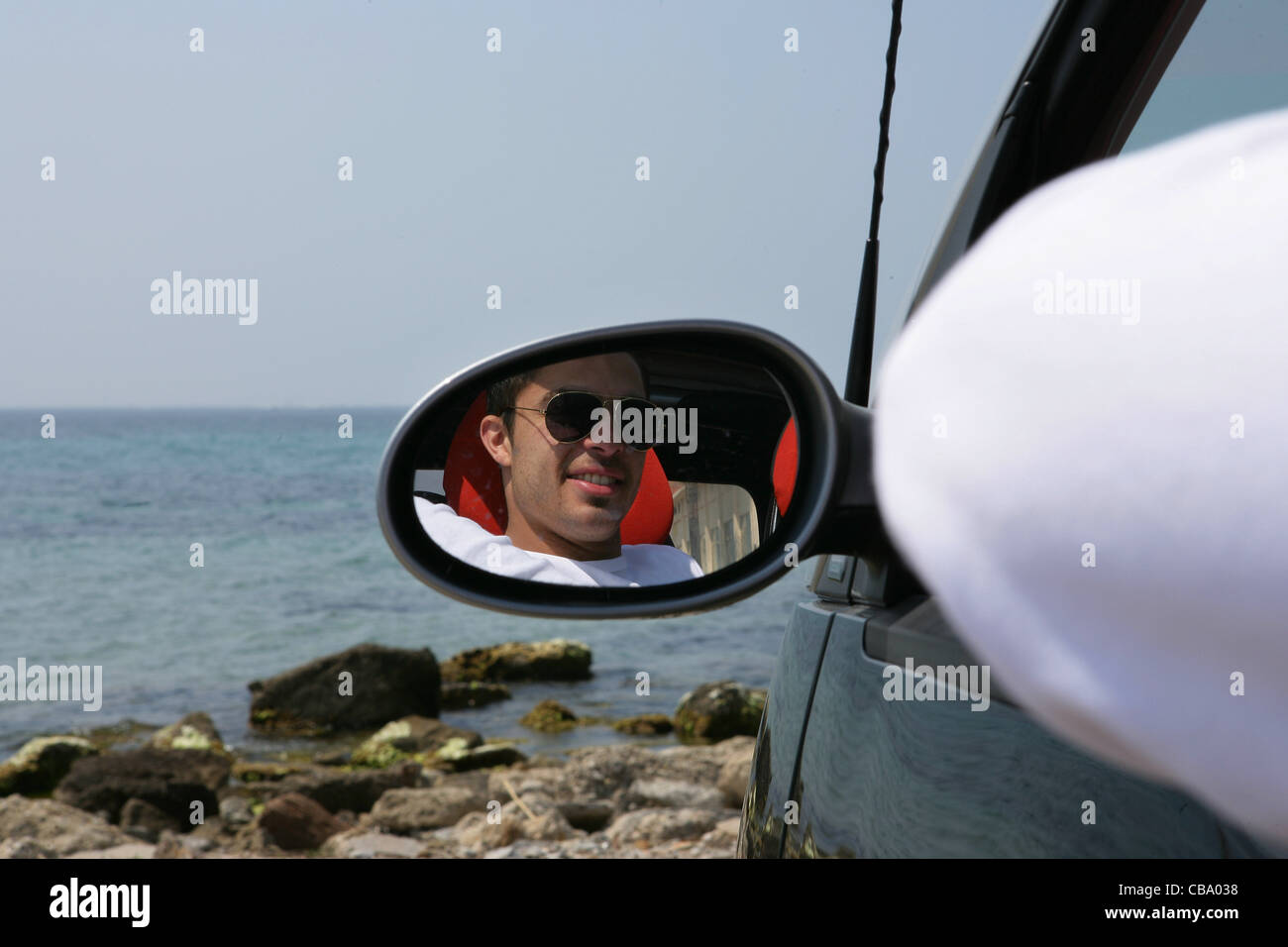 Rear view mirror man sunglasses hi-res stock photography and images - Alamy