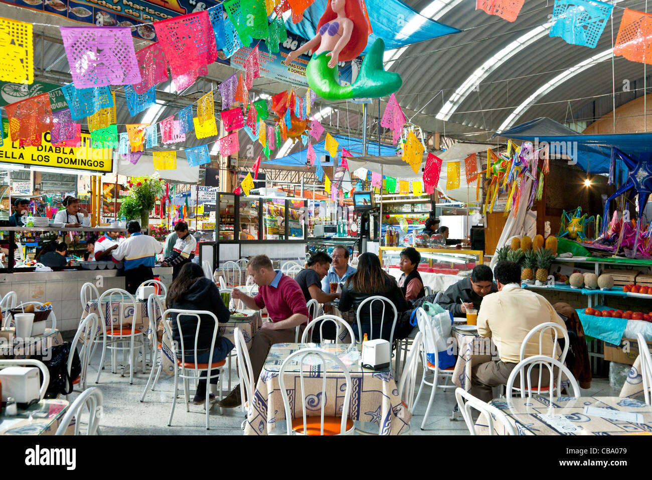 groups of people enjoying lunch in bright cheerful seating area of ...