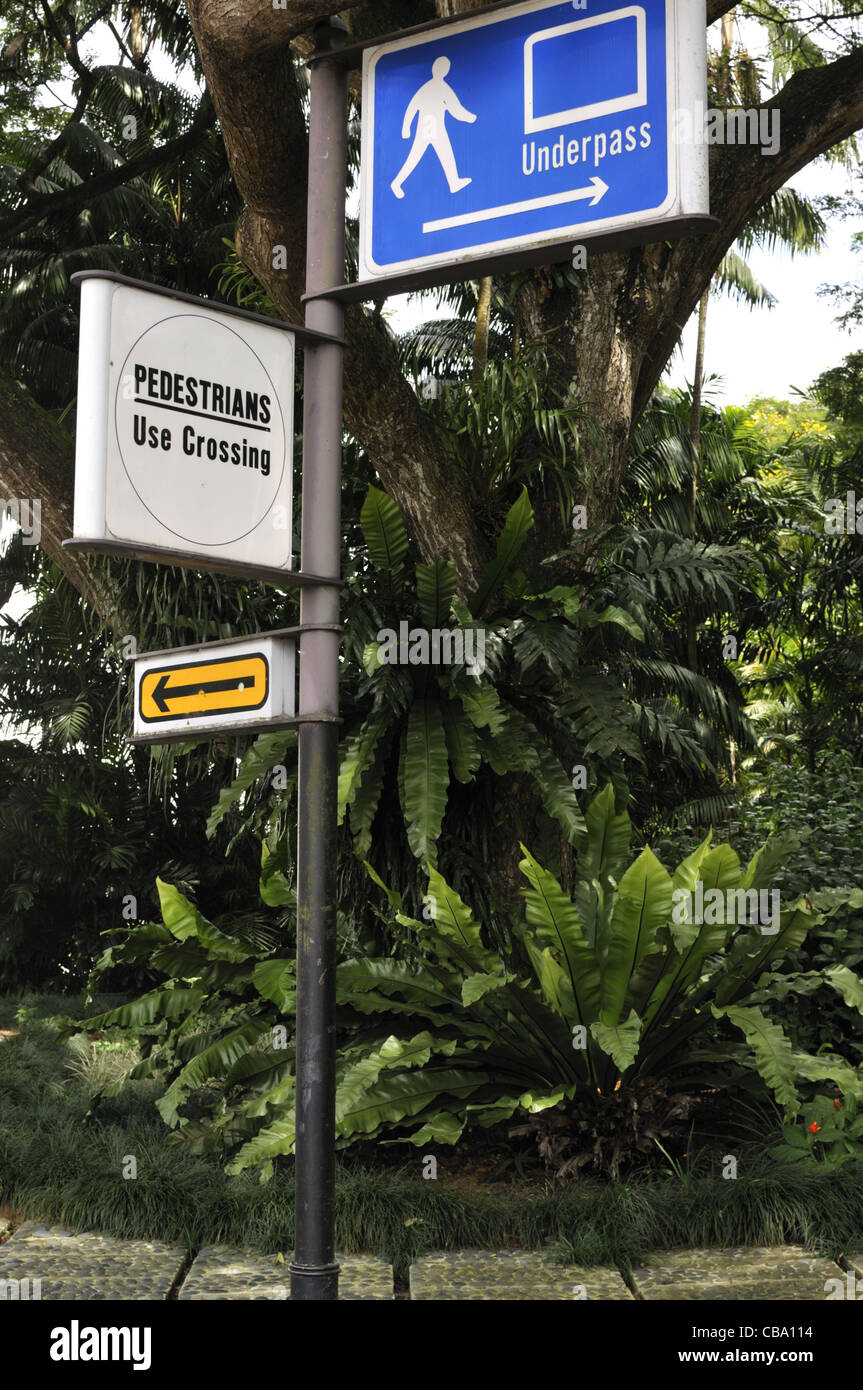 Instruction signs to use underpass, Singapore Stock Photo - Alamy
