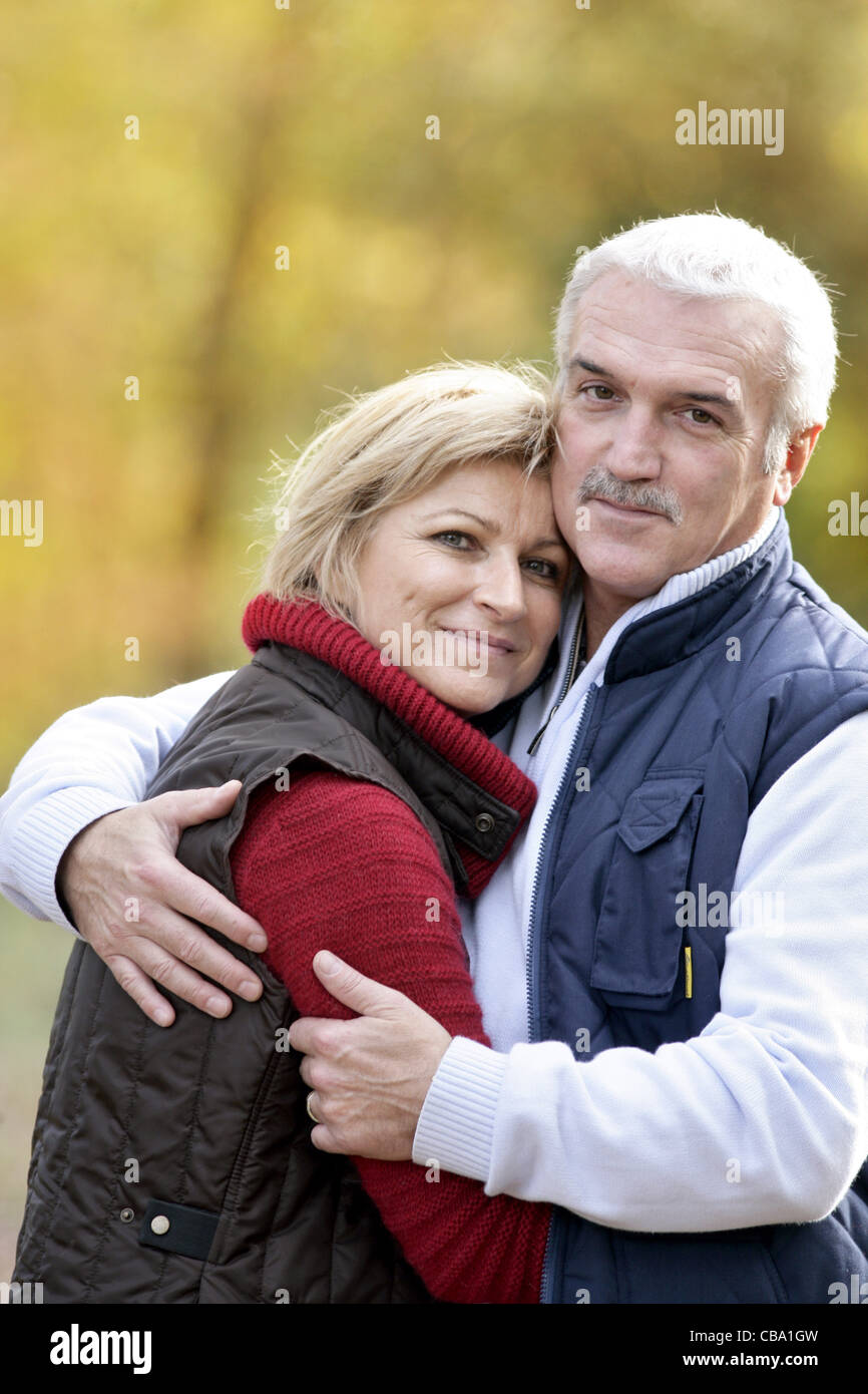 Portrait of a couple hugging Stock Photo - Alamy