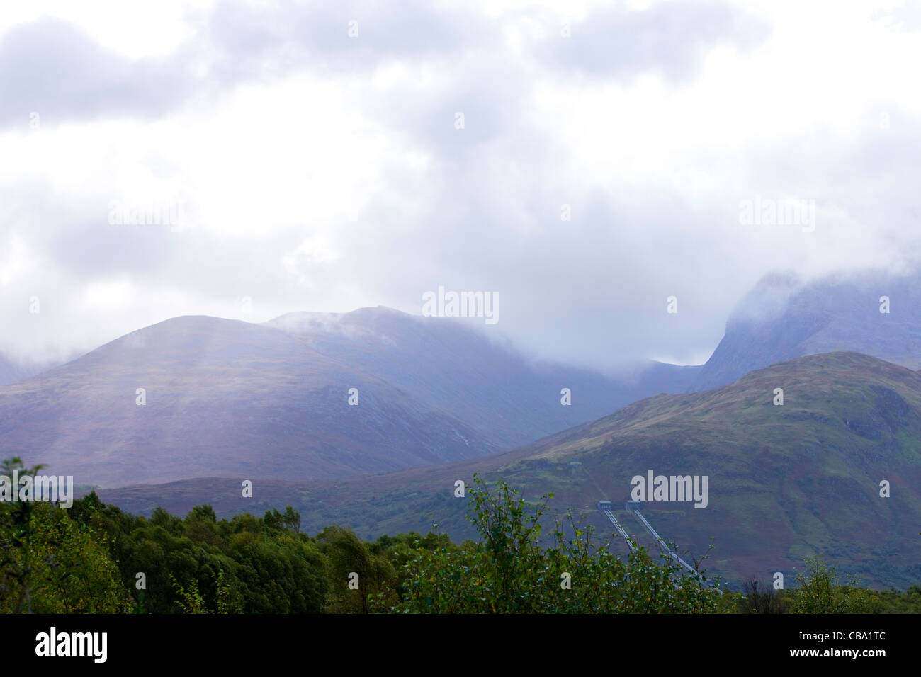 Low lying cloud over mountain side Scotland Stock Photo - Alamy
