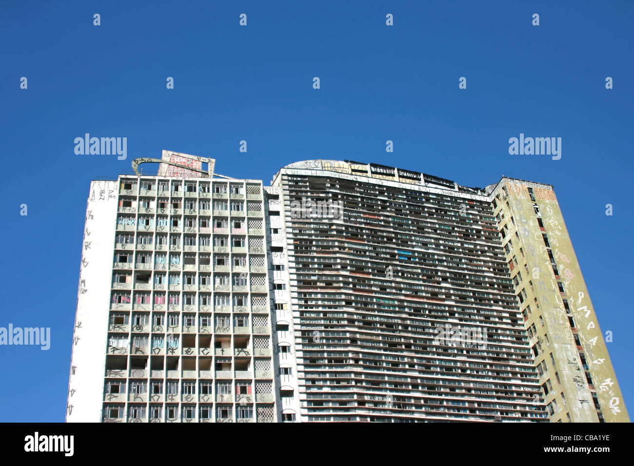 Facade of a rundown building in a poor neighborhood in the center of ...