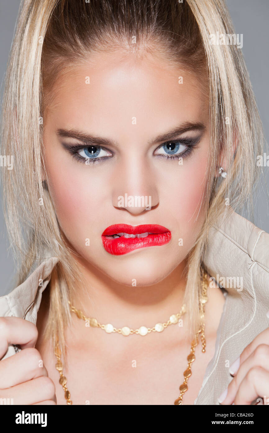 Biting lip woman lipstick hi-res stock photography and images - Alamy