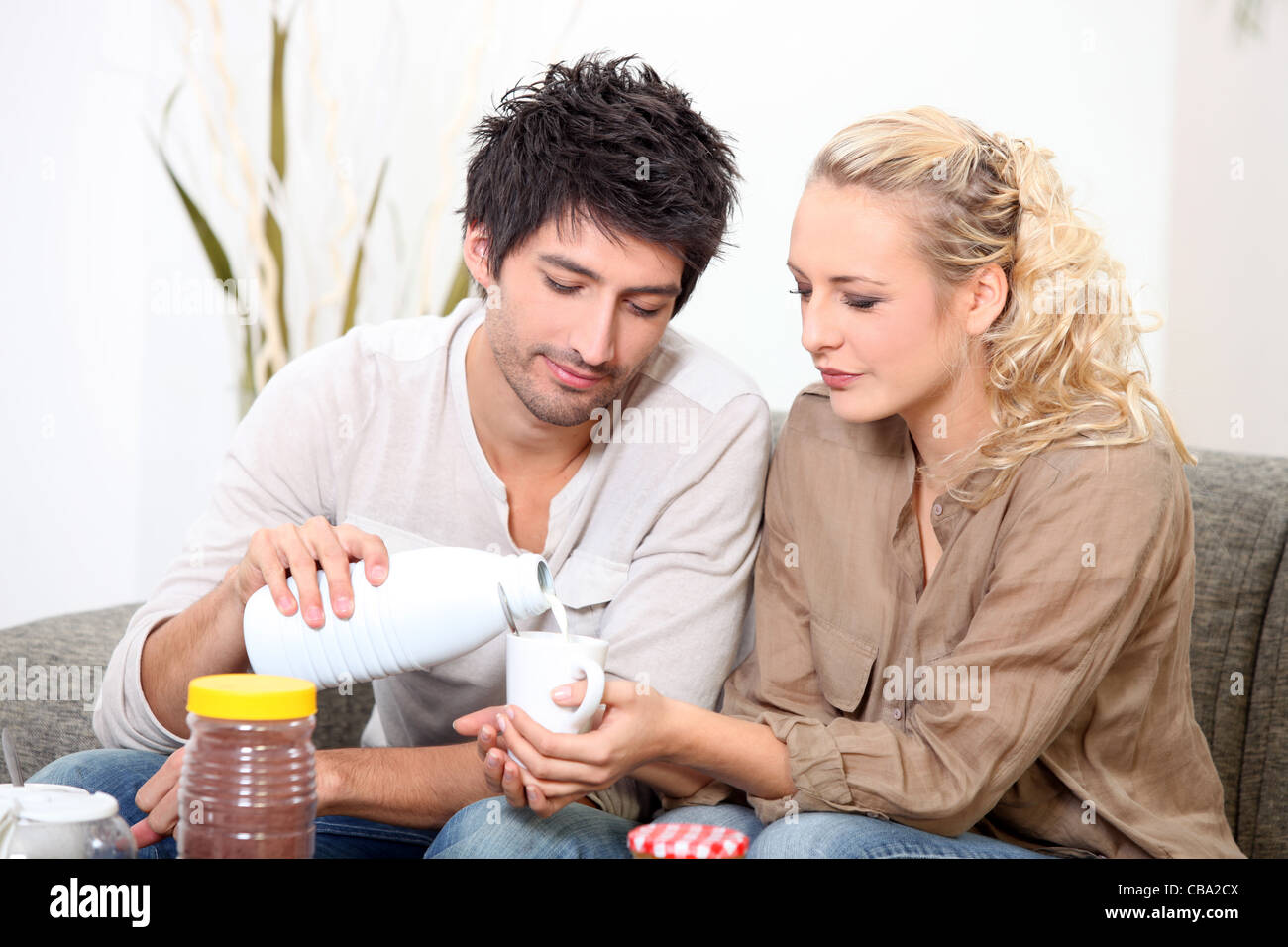 Couple drinking milk Stock Photo - Alamy