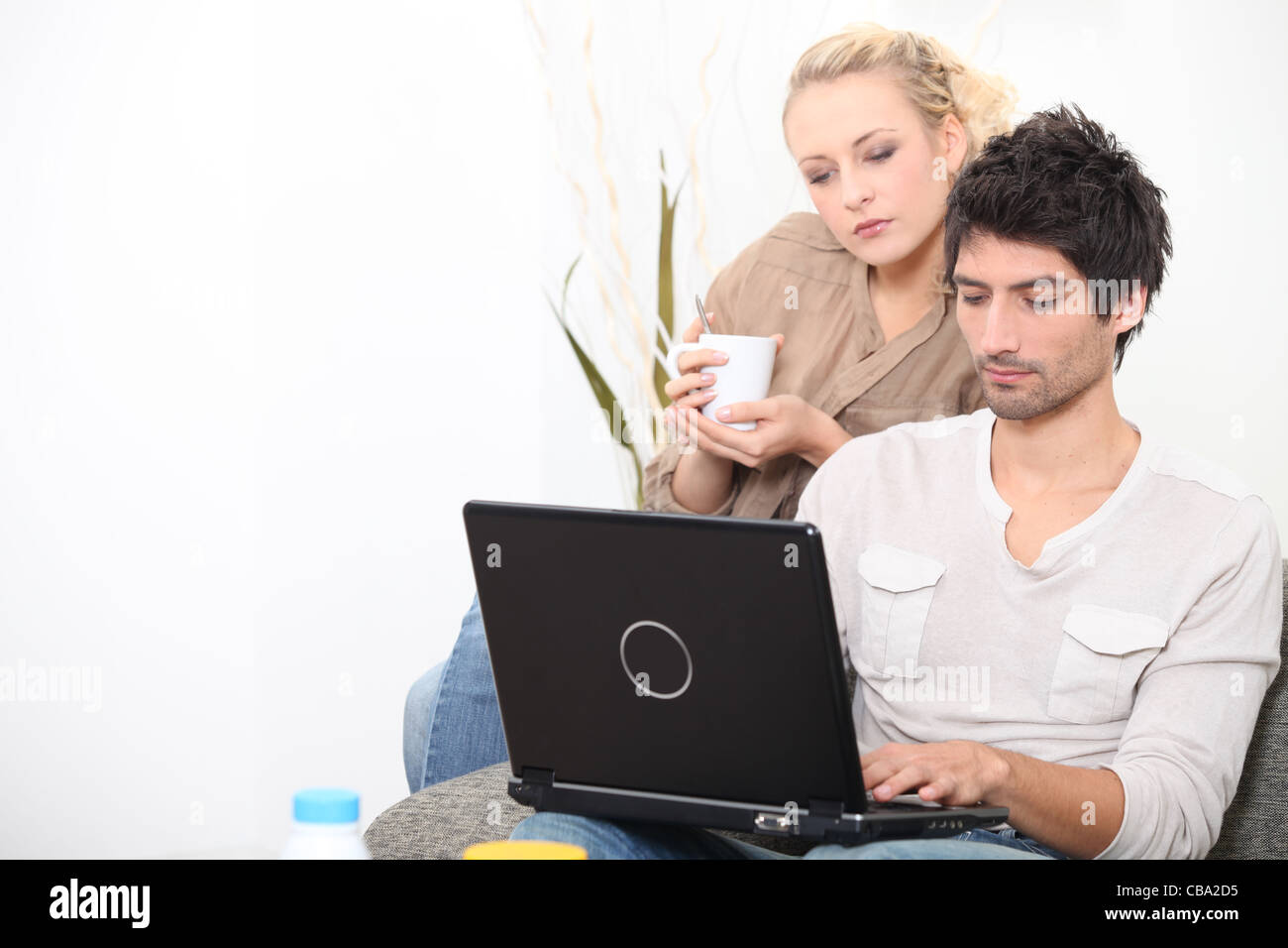 Couple on laptop Stock Photo - Alamy