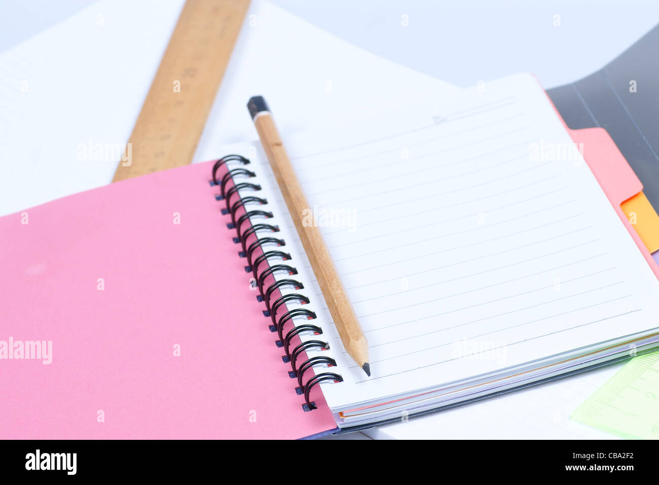 Notebook and pencil Stock Photo - Alamy