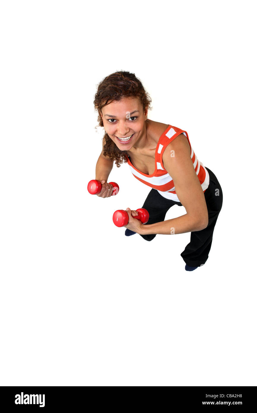 Woman using dumbbells Stock Photo - Alamy