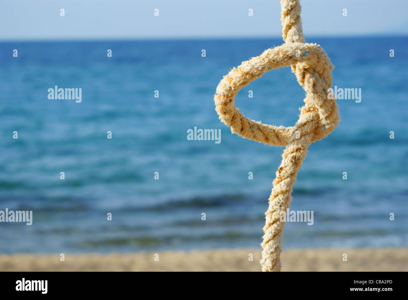 rope with a knot - sea background Stock Photo - Alamy