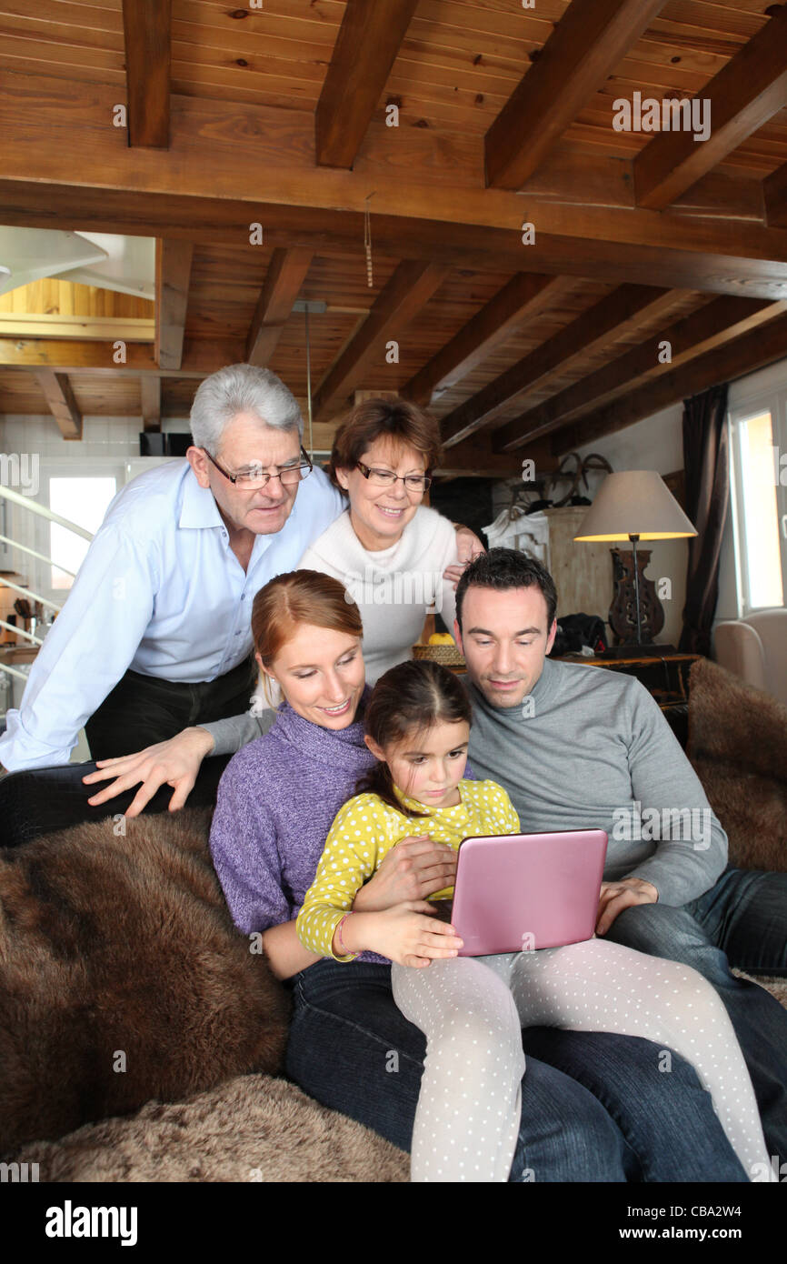 Family in front of a computer Stock Photo - Alamy