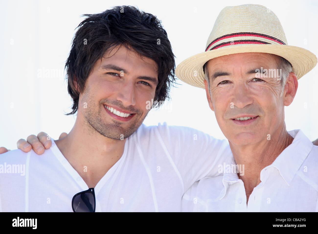 Two men with their arms around each other's shoulders Stock Photo - Alamy