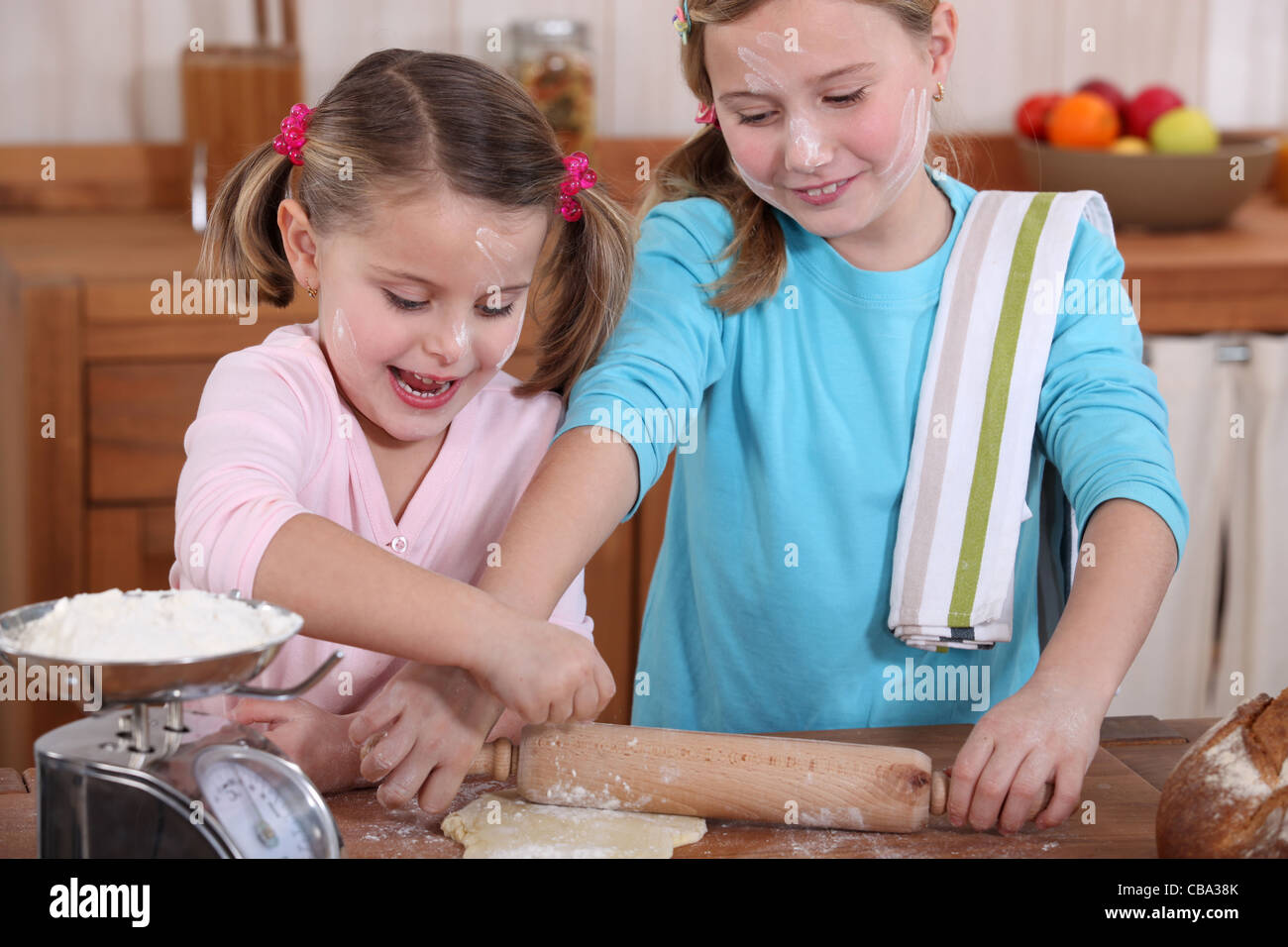 two little girls making pancakes Stock Photo - Alamy