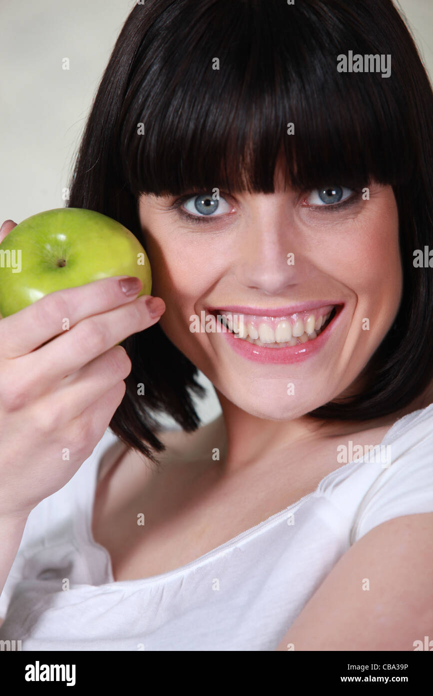 Woman with apple Stock Photo - Alamy