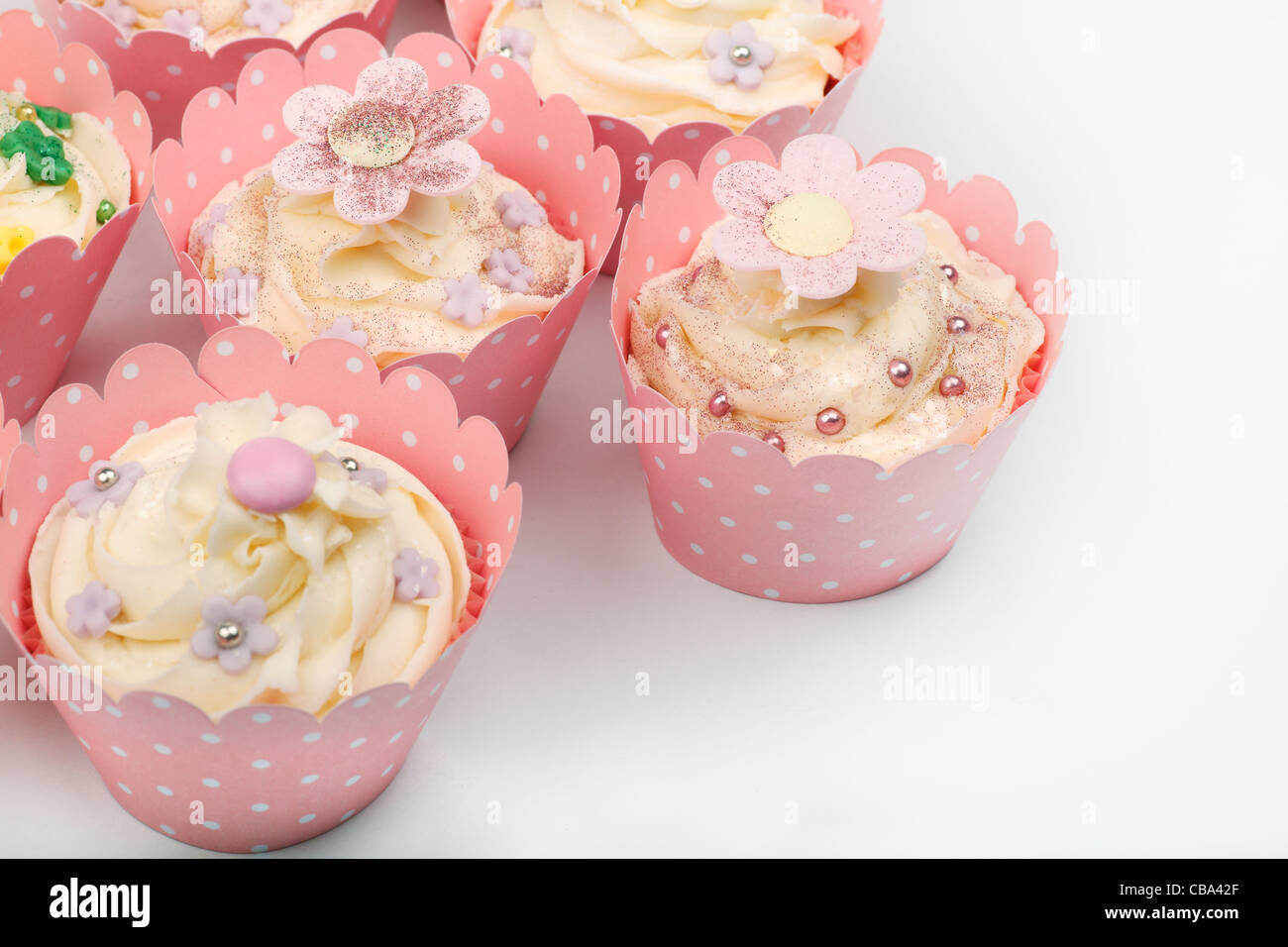 Cupcakes on white surface Stock Photo - Alamy