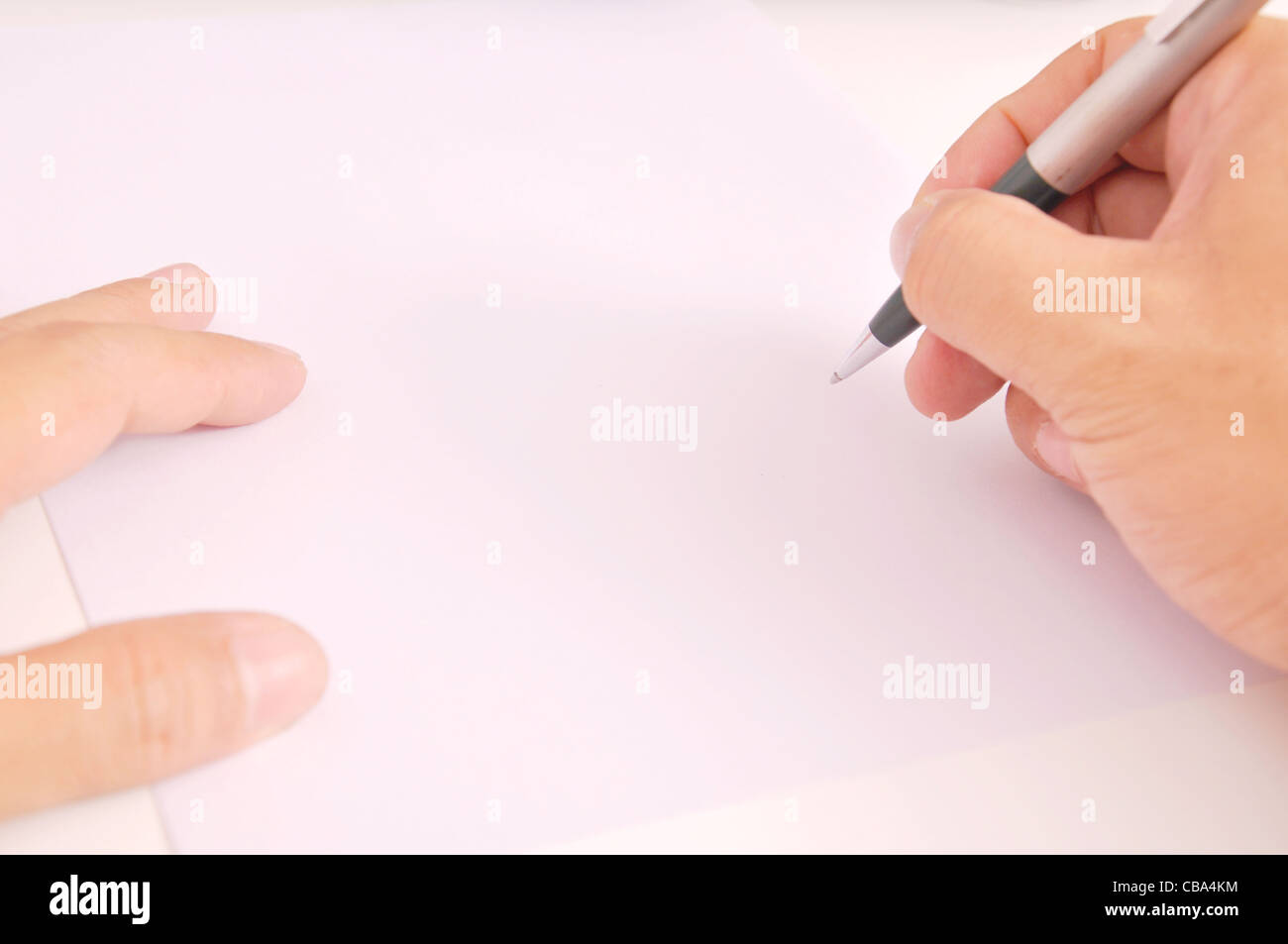 A picture of holding pen with white paper Stock Photo - Alamy