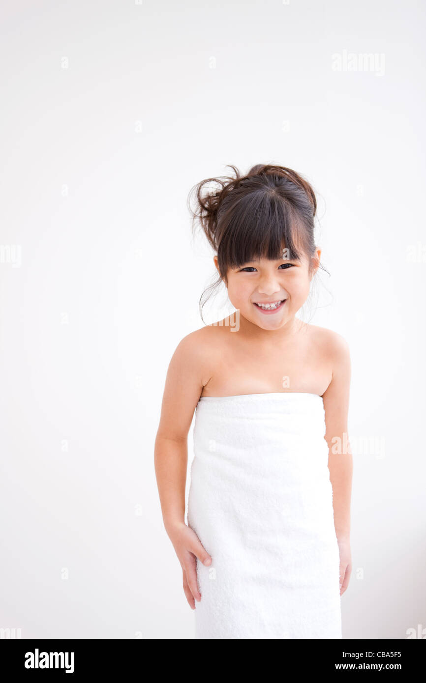 Portrait of girl wrapped in towel Stock Photo - Alamy