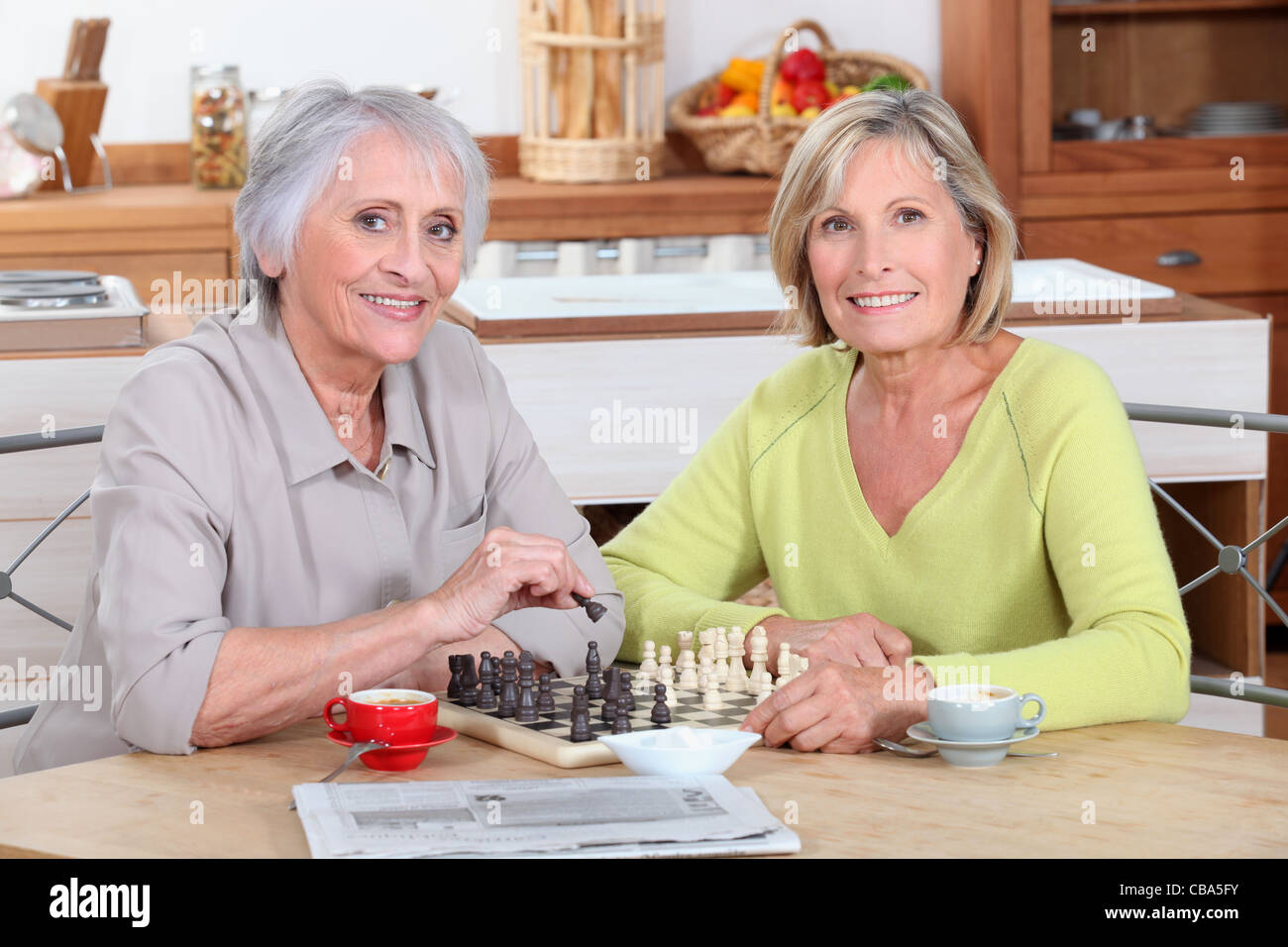 Old lady playing chess hi-res stock photography and images - Alamy