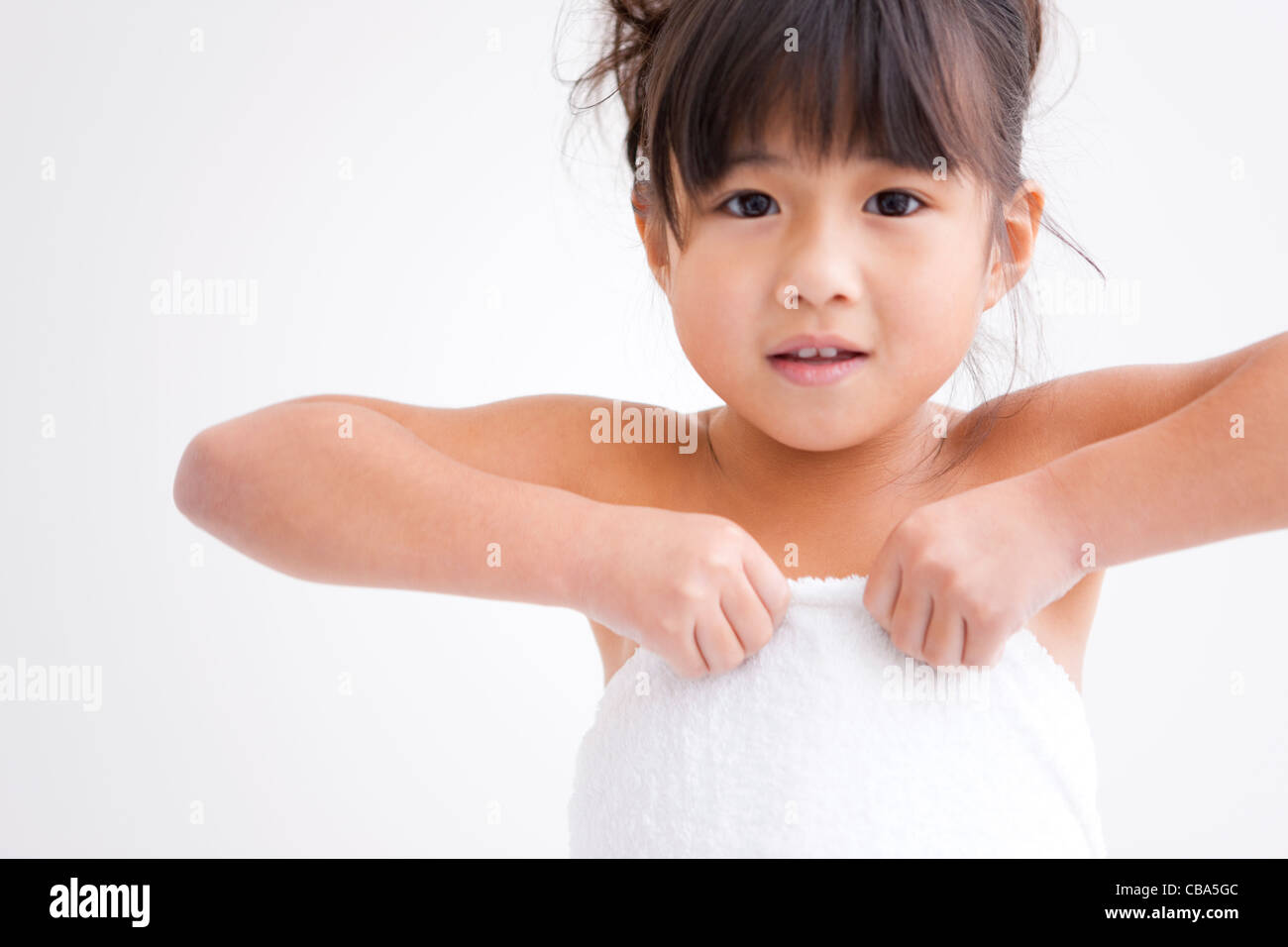 Girl pulling up a wrapped towel Stock Photo - Alamy