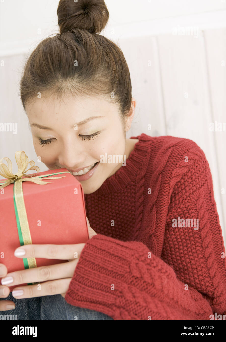 Woman Holding Present Stock Photo - Alamy