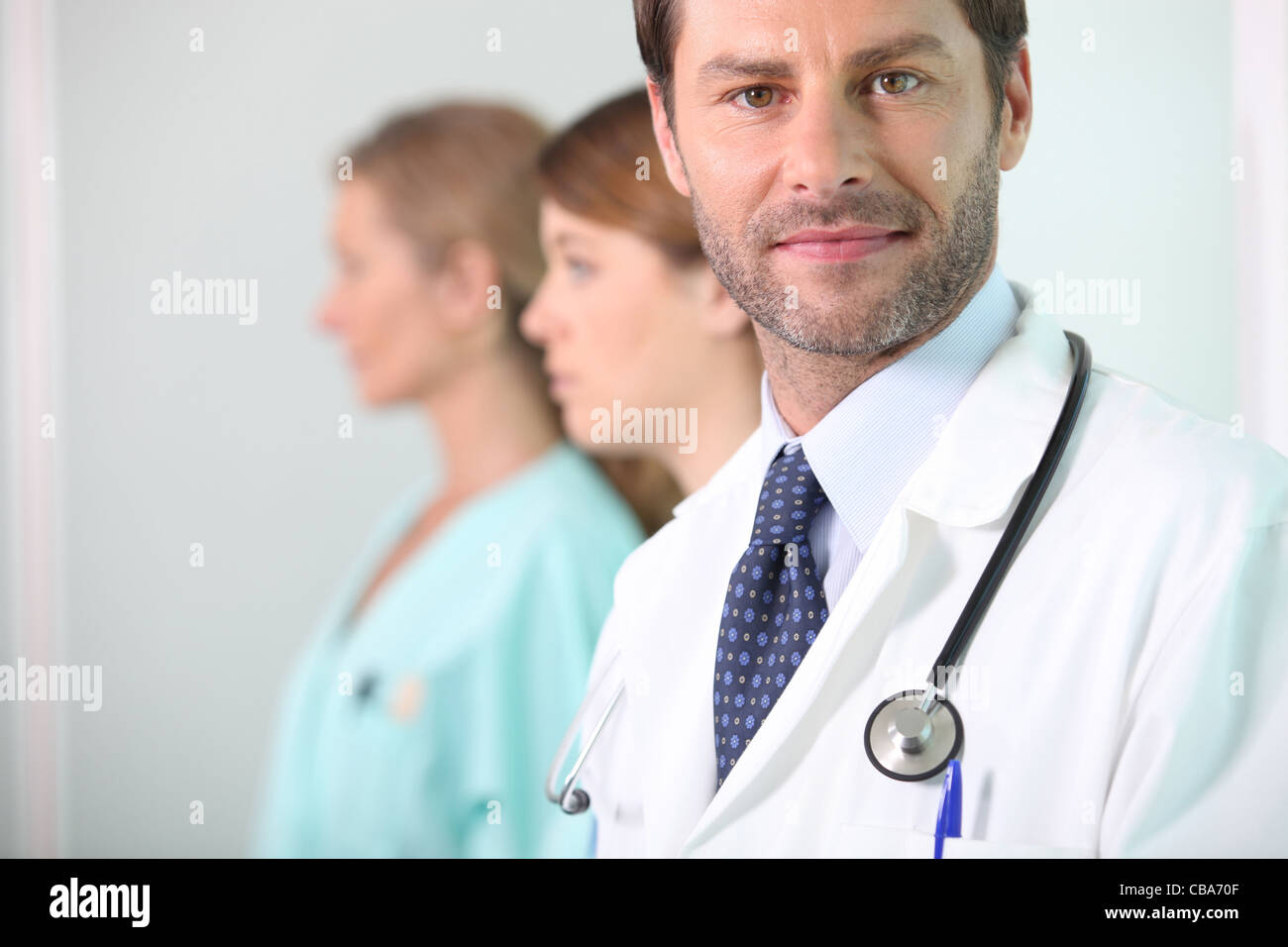 A medical doctor with his assistants Stock Photo - Alamy