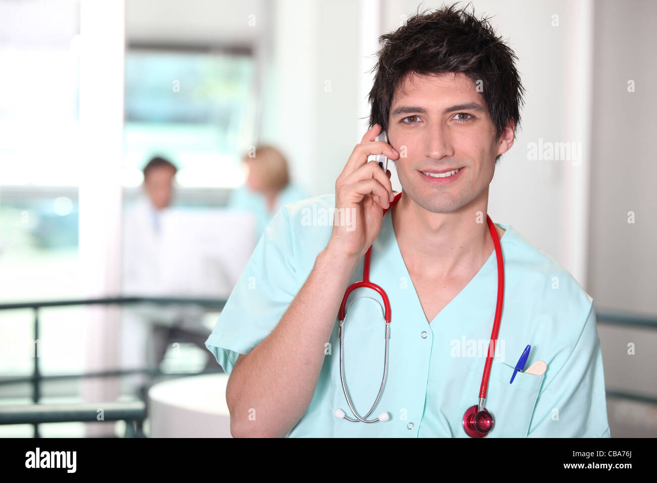 Healthcare worker talking on the phone Stock Photo - Alamy