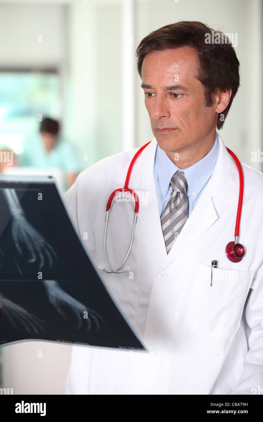 Male doctor analysing x-rap image Stock Photo - Alamy