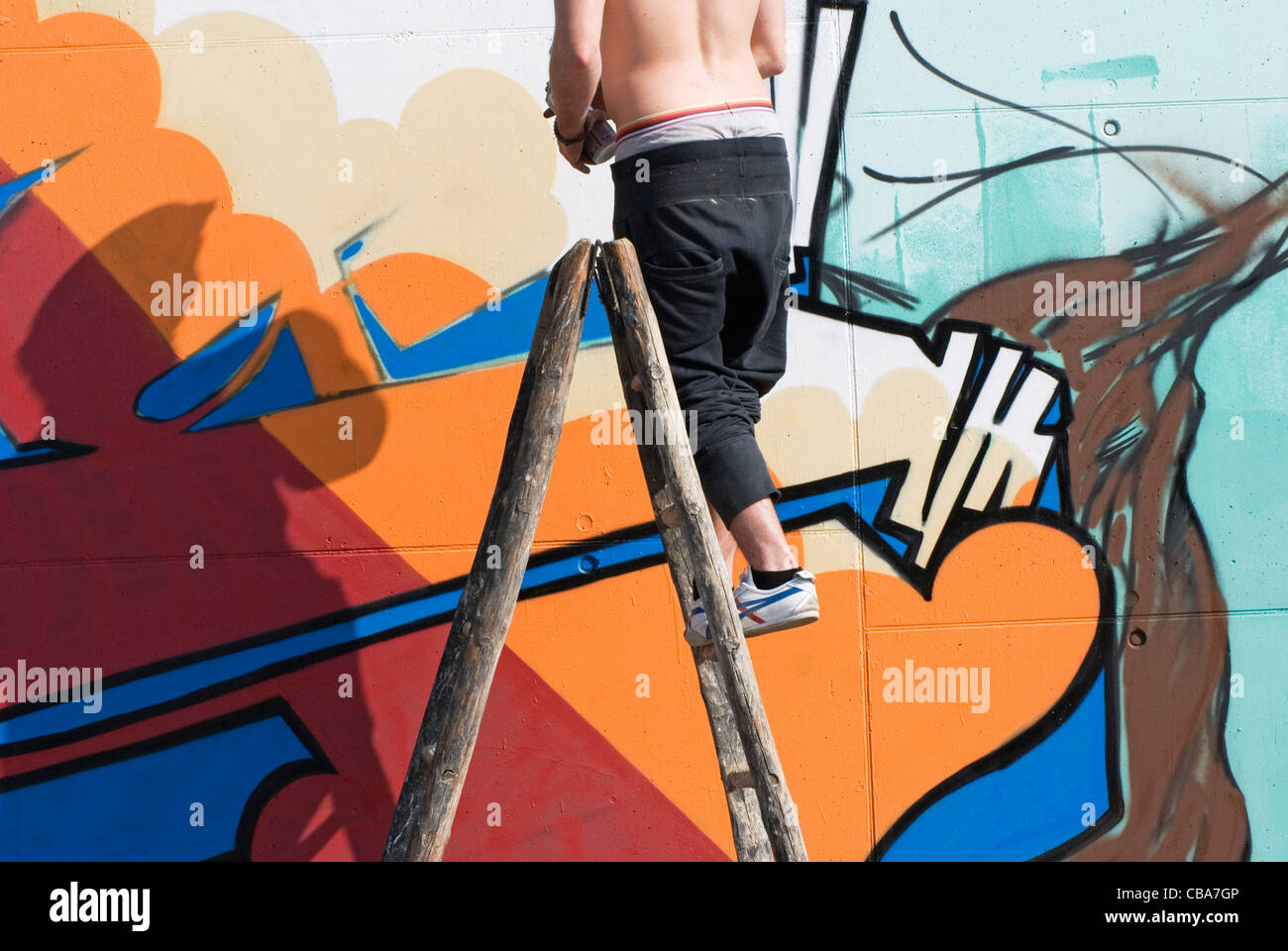 Graffiti artist on ladder Stock Photo - Alamy