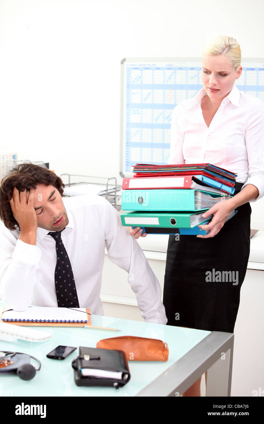 Overworked businessman and his assistant Stock Photo - Alamy