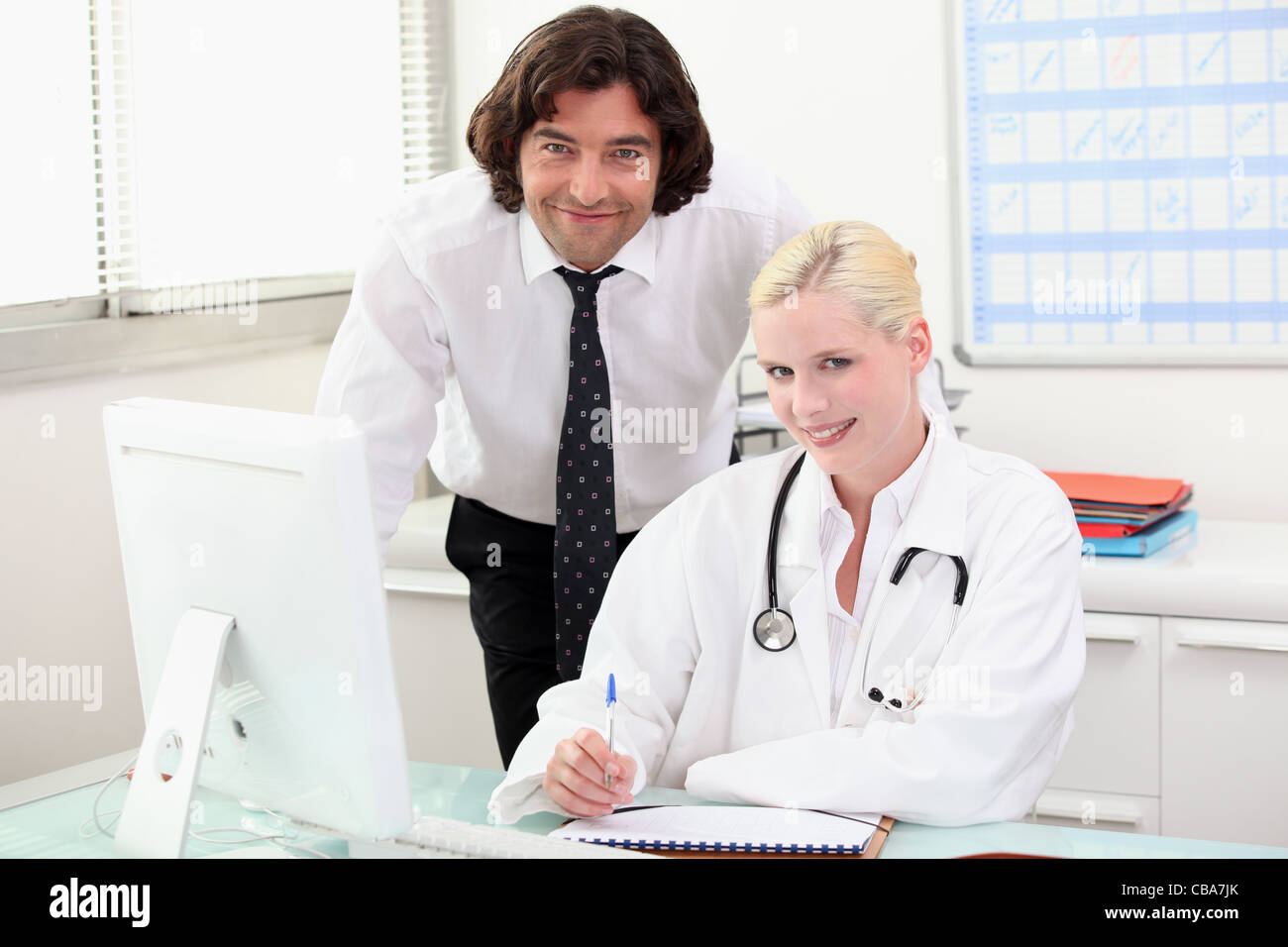 Doctor at a desk Stock Photo - Alamy