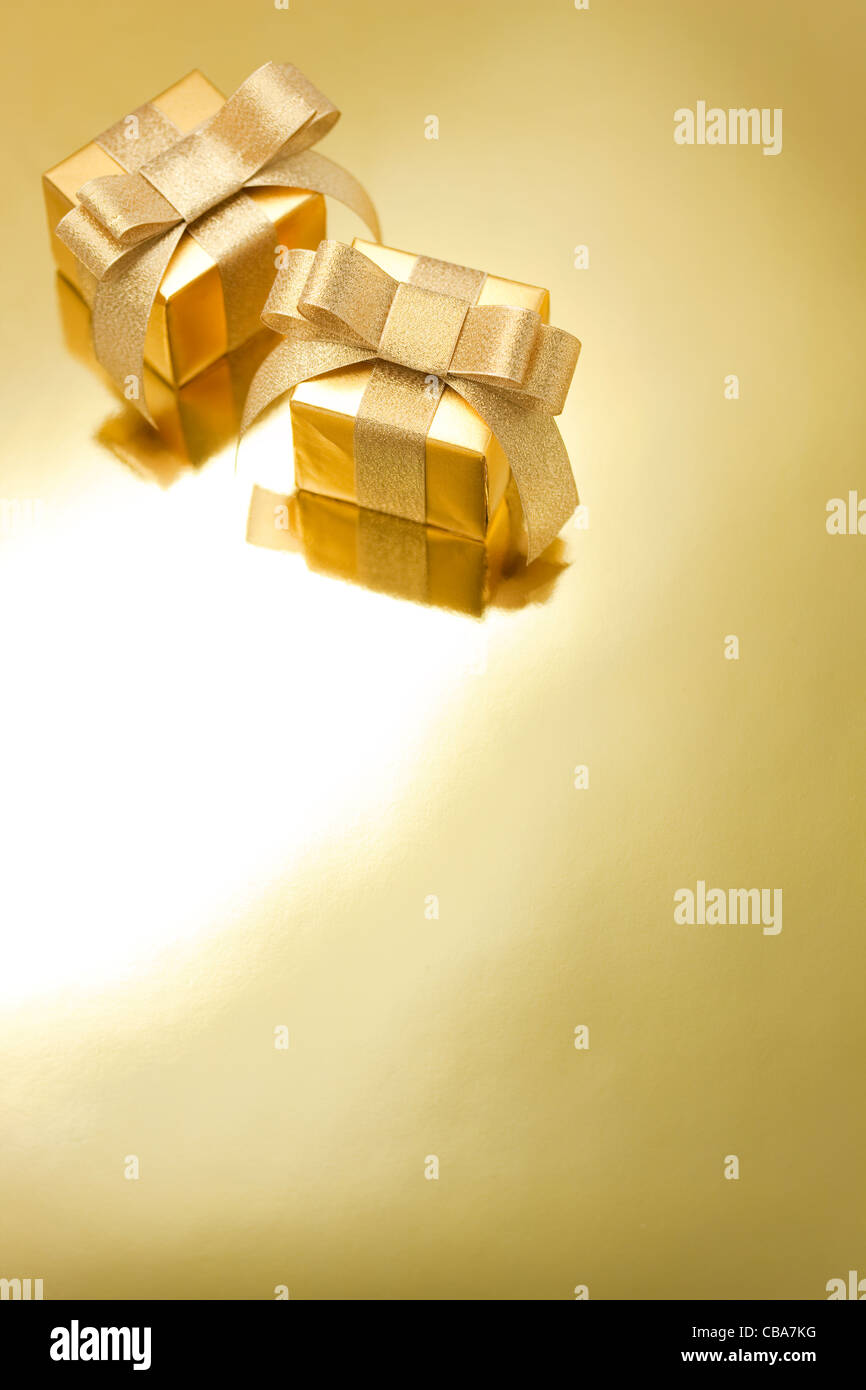 Two Golden Gift Boxes Stock Photo - Alamy