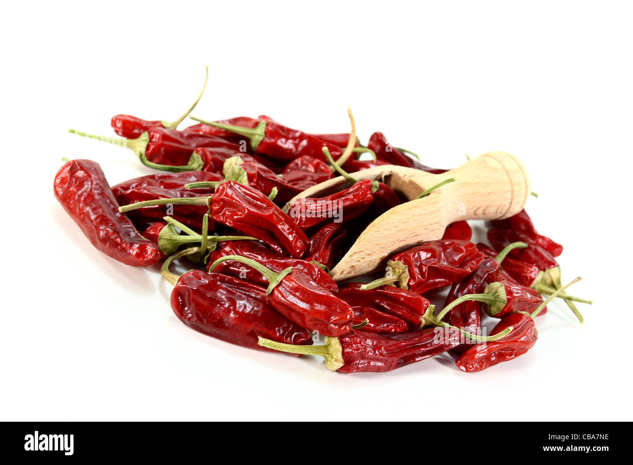 dried red paprika with bushel on a white background Stock Photo - Alamy