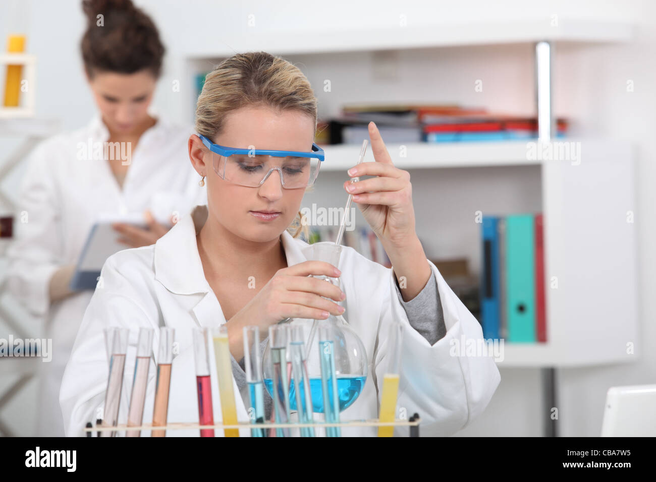 Two students in science class Stock Photo - Alamy