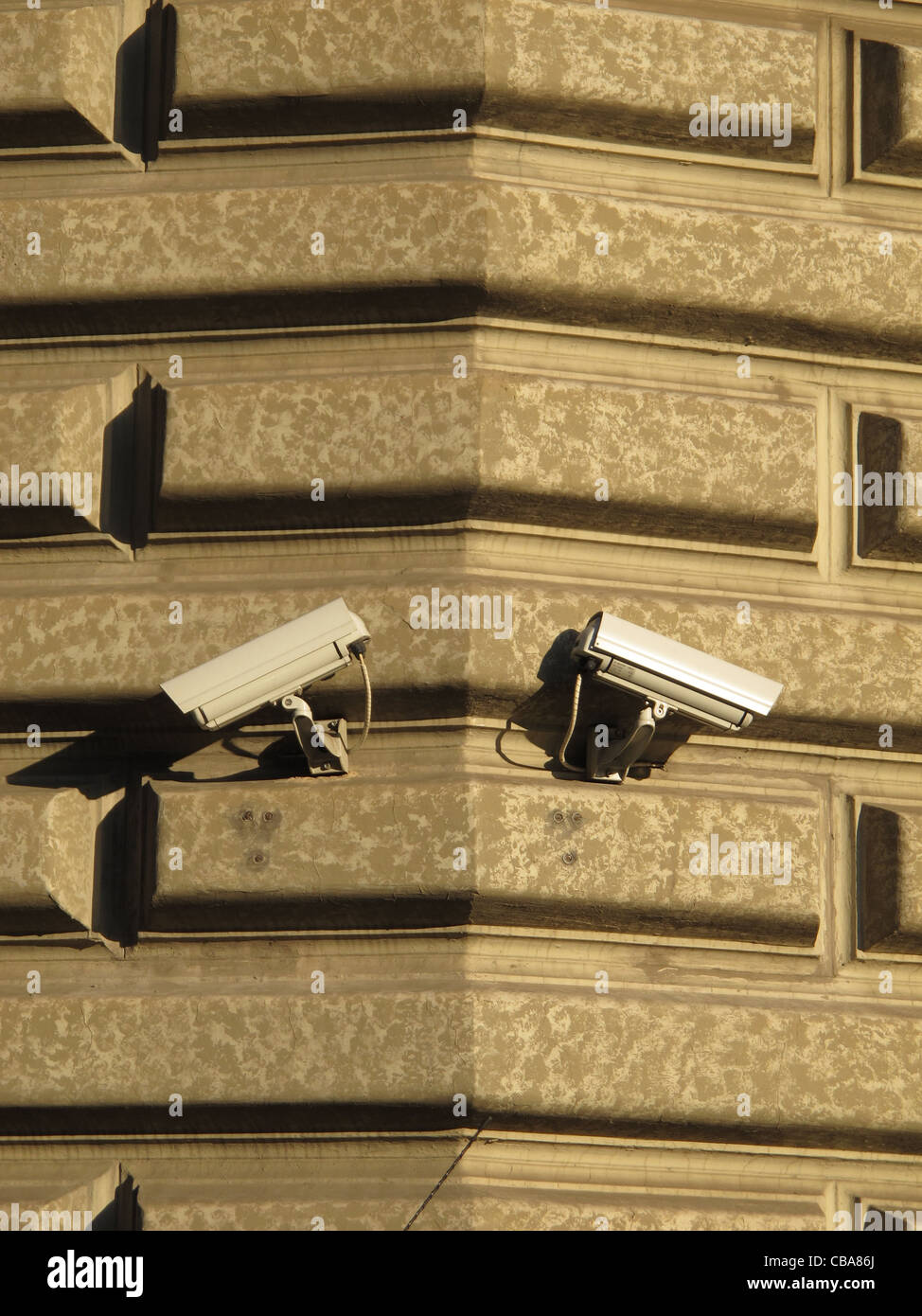 two cctv cameras by building property entrance outdoors Stock Photo - Alamy