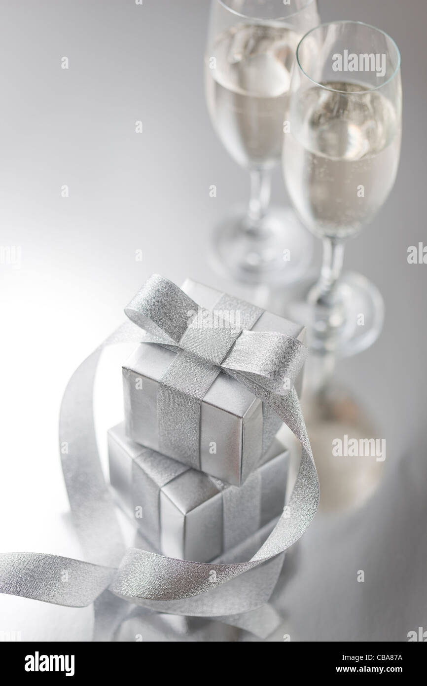 Silver Gift Boxes and Champagne Stock Photo - Alamy