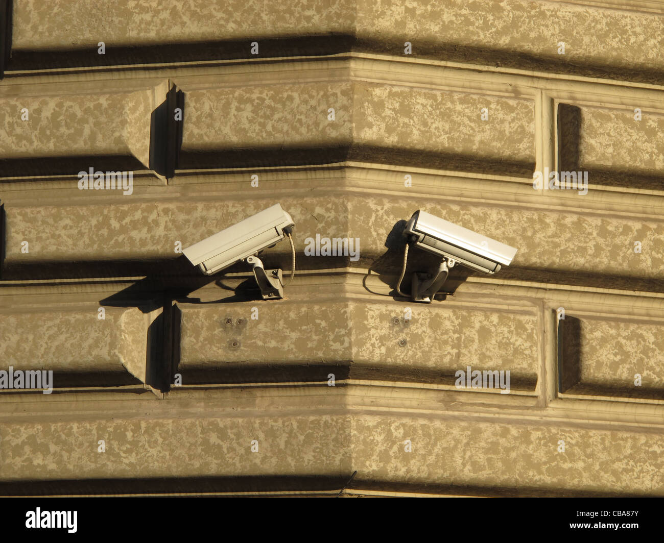 two cctv cameras by building property entrance outdoors Stock Photo - Alamy