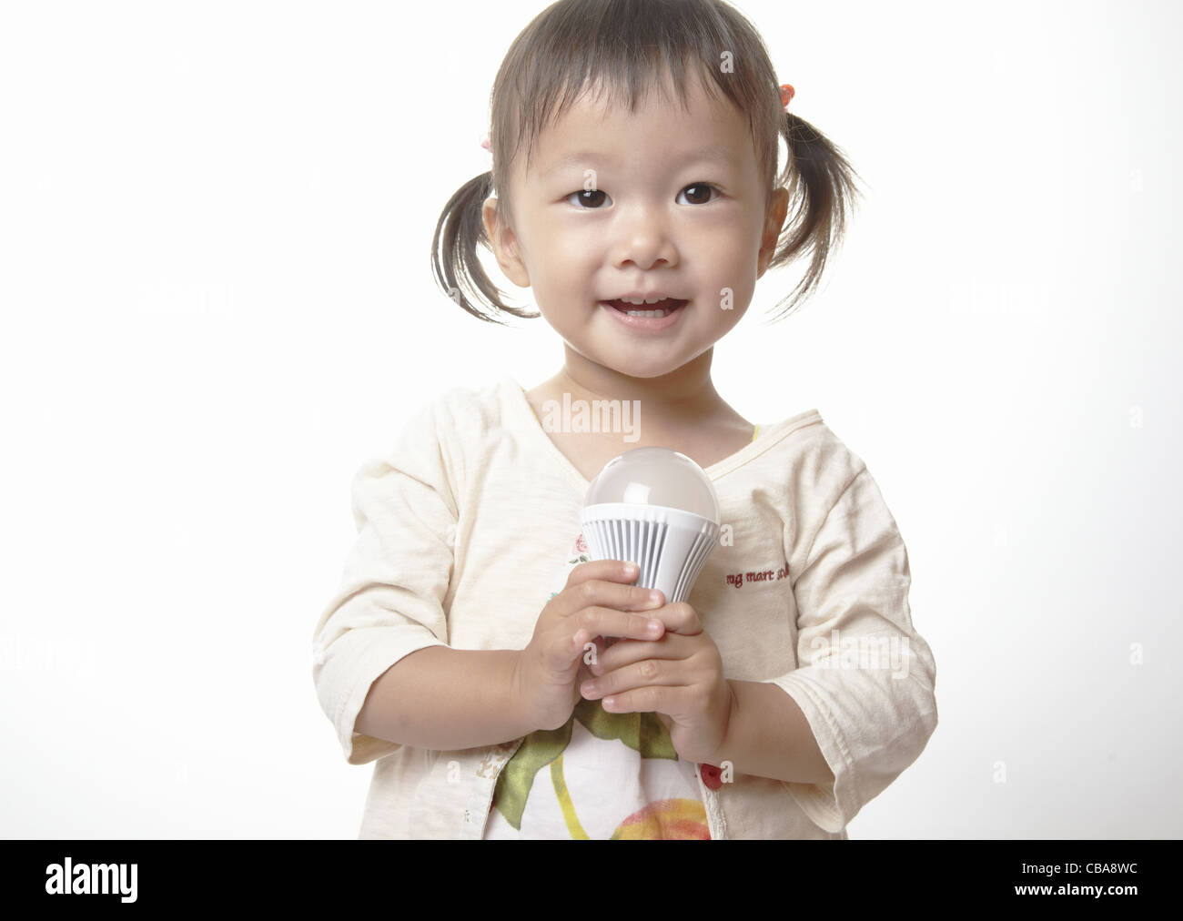 Girl holding a LED bulb Stock Photo - Alamy
