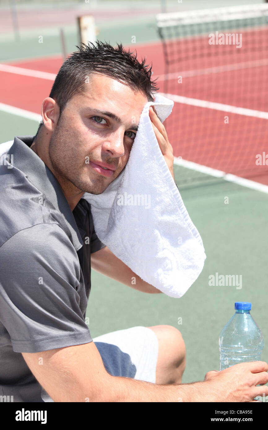 Tennis player drying head Stock Photo - Alamy