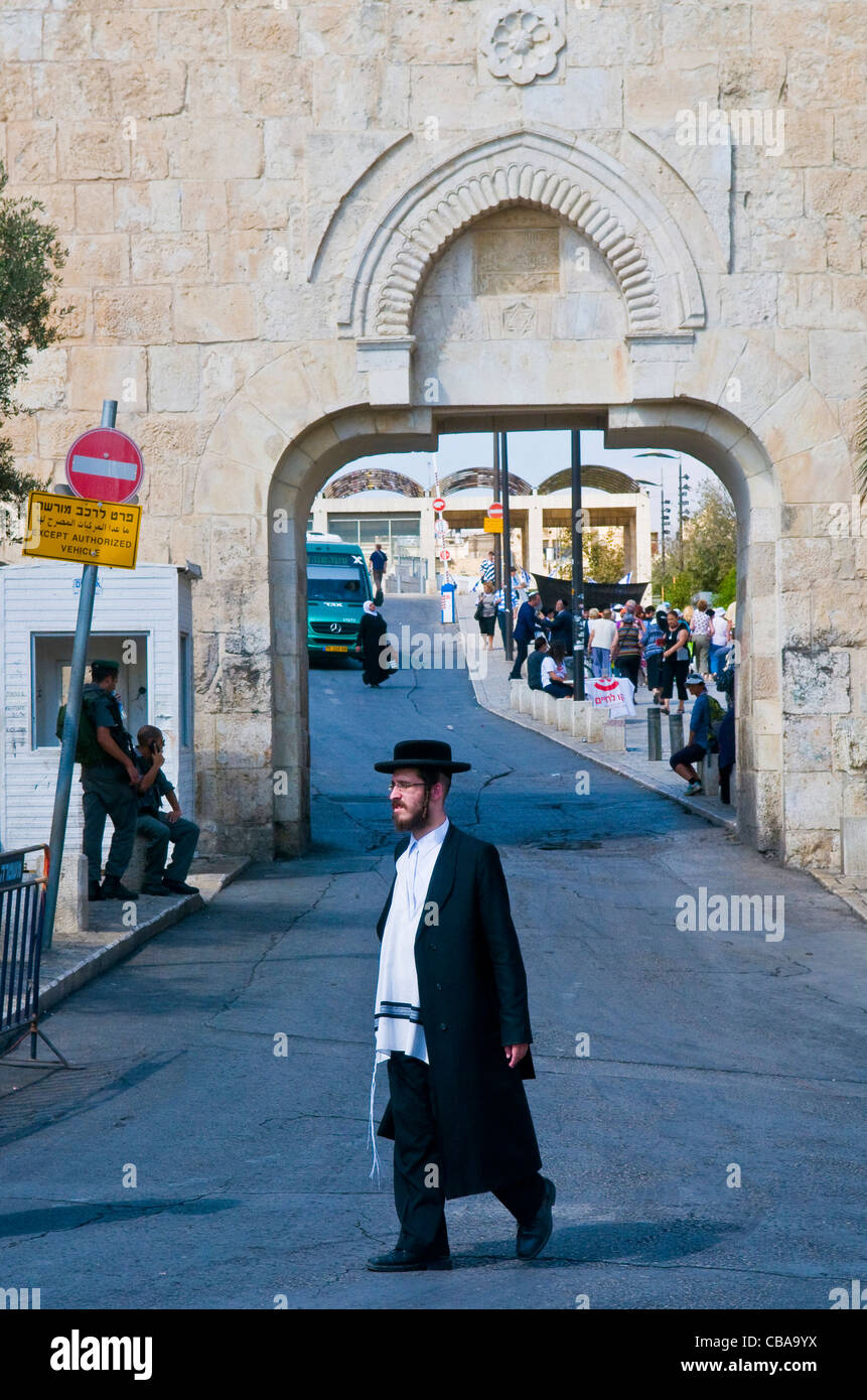 An ultra- Orthodox Jewish man stand near the Dung gate in the old city ...