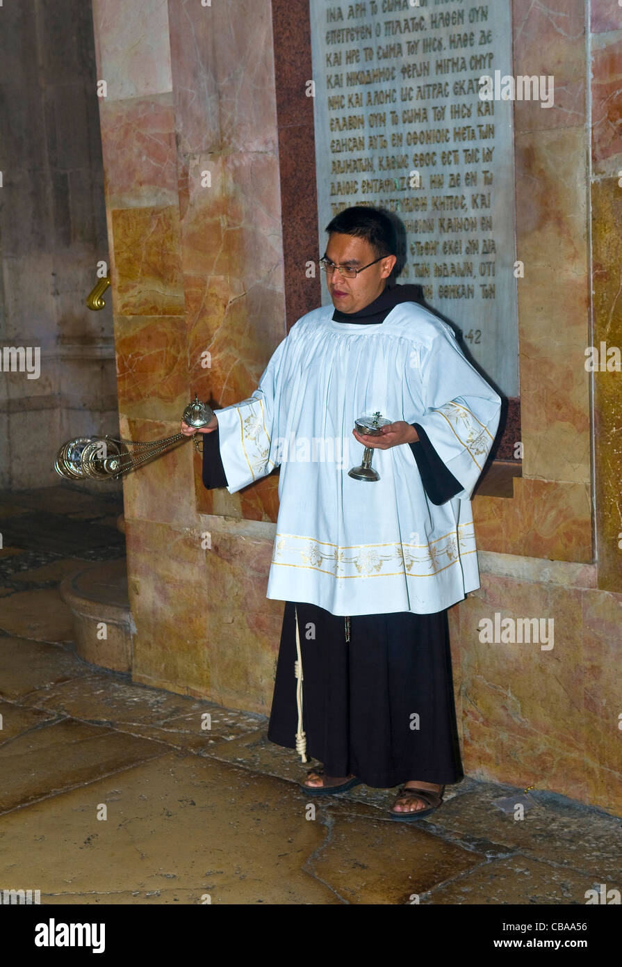 Thurible held by altar server in the church of the holy sepulcher in ...
