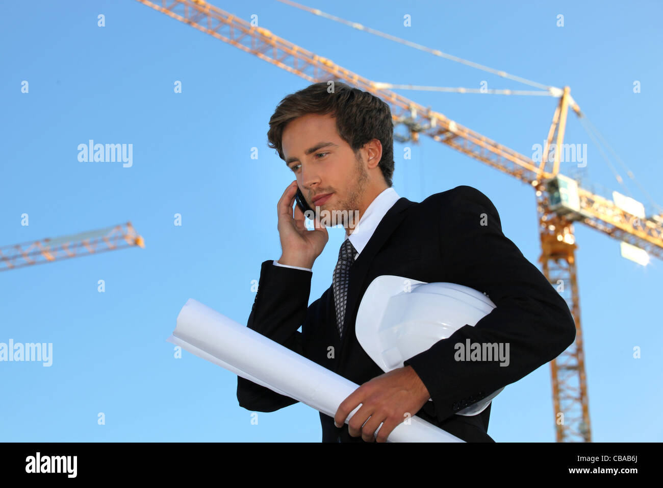 Young and handsome engineer working on-site Stock Photo - Alamy