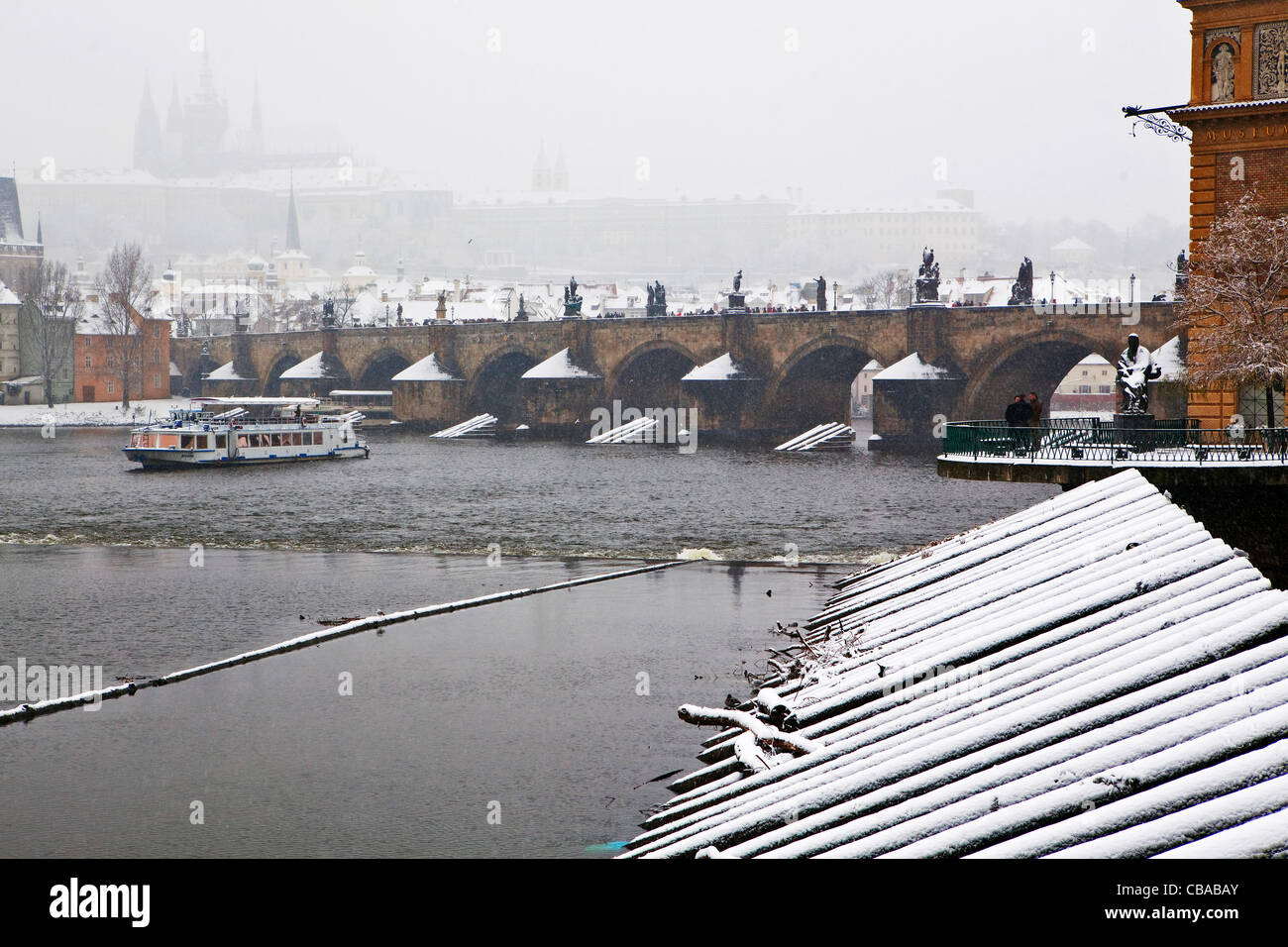 Snow covered wave breakers on Vltava river in Prague, Czech Republic on ...
