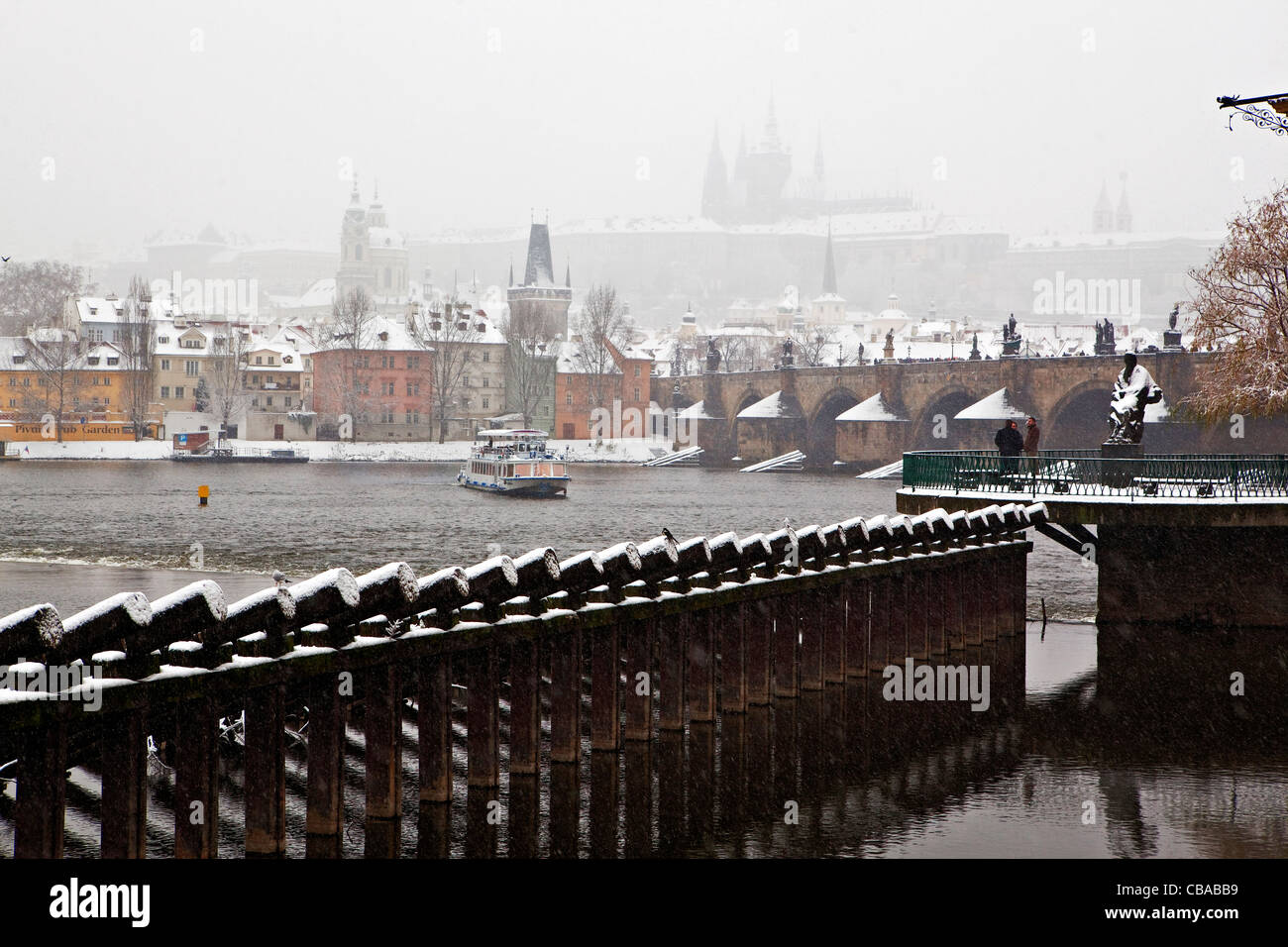 Snow covered wave breakers on Vltava river in Prague, Czech Republic on ...
