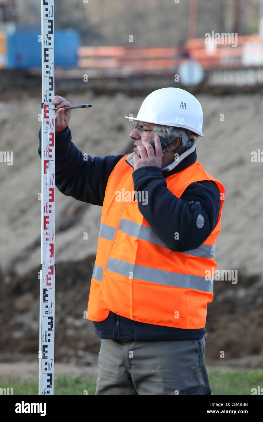 surveyor taking measurements Stock Photo - Alamy