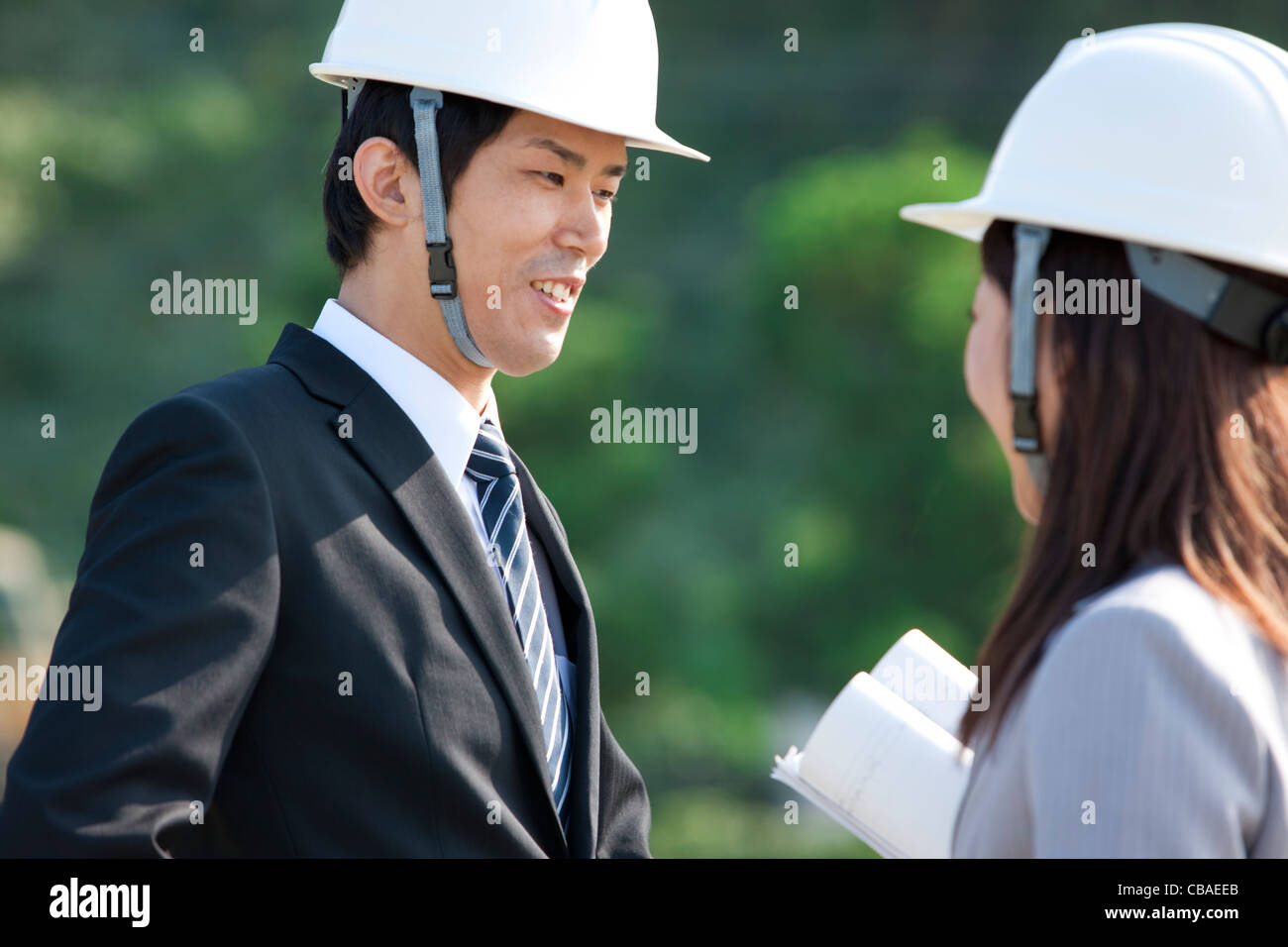Young adults construction site talking hi-res stock photography and ...