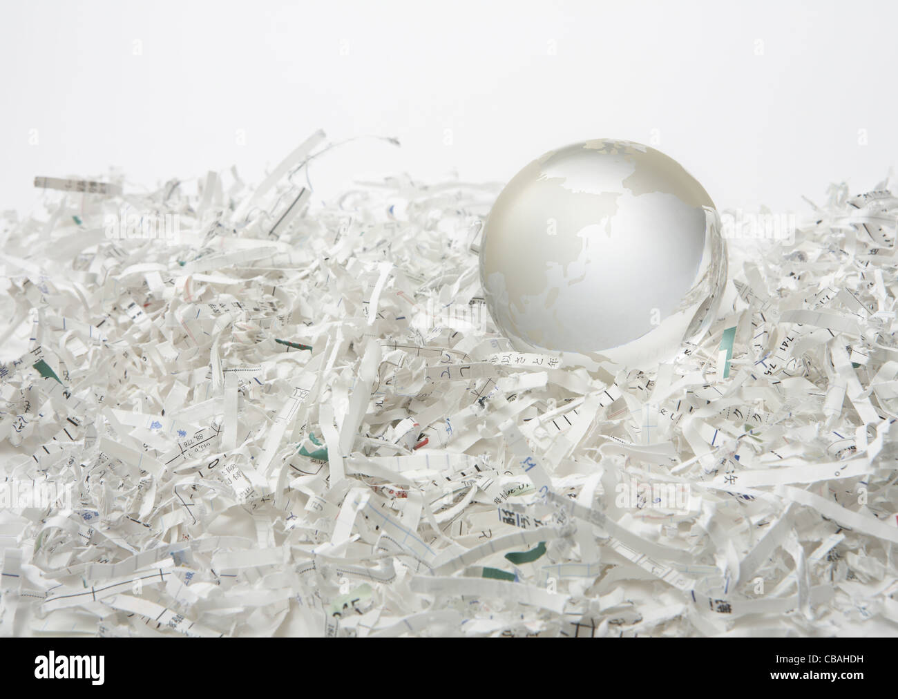 Shredder dust and globe Stock Photo - Alamy