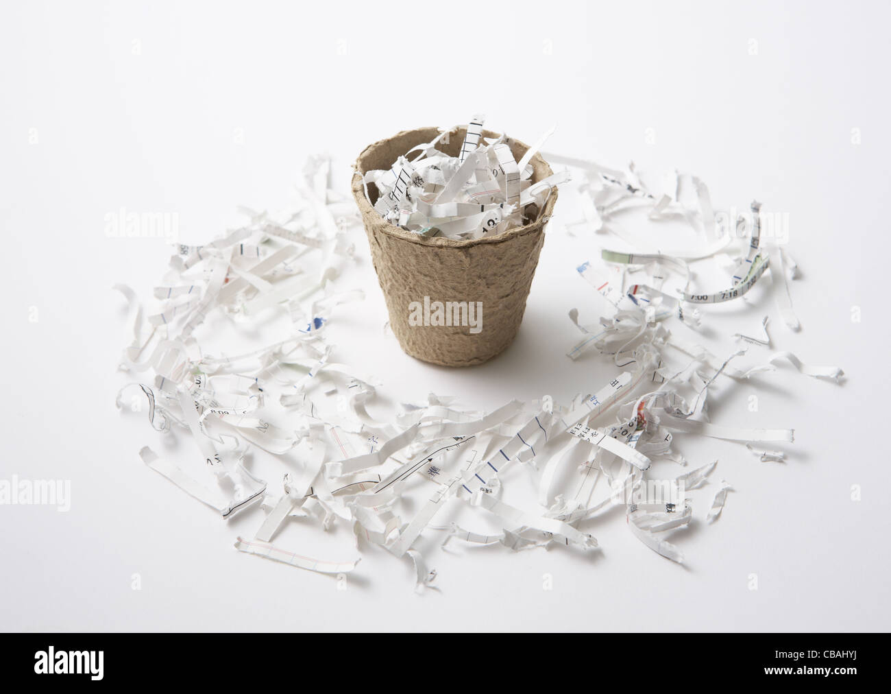 Shredder dust in a trash can Stock Photo - Alamy
