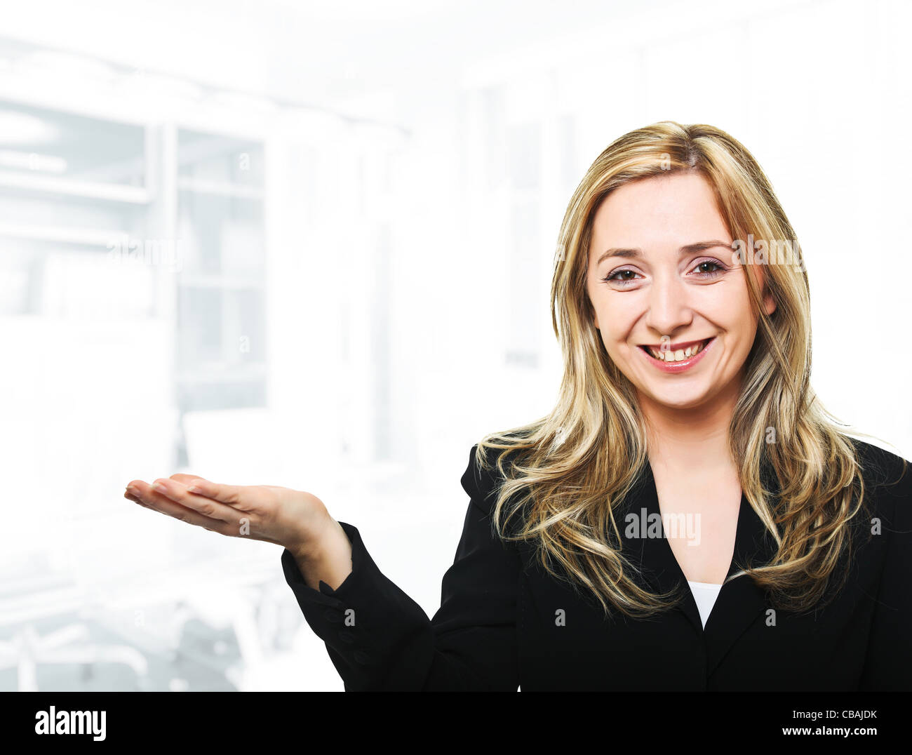 woman in show pose and office background Stock Photo - Alamy