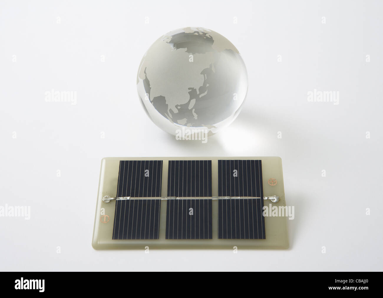 Globe and solar panels Stock Photo - Alamy